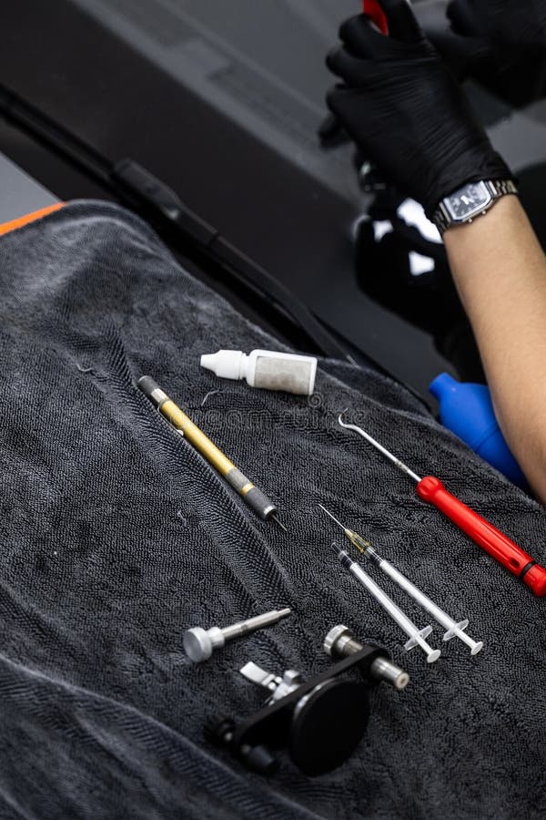 Auto Windshield Crack Repair Tools on Work Surface. Essential Tools for ...