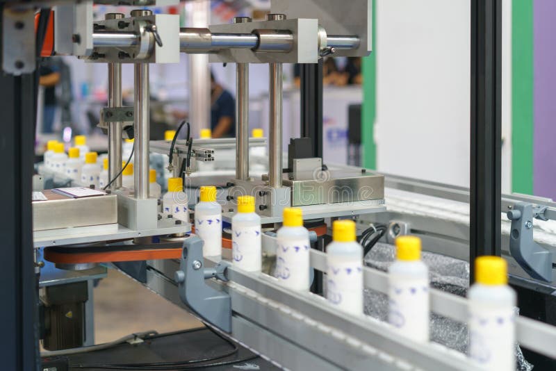Automated Bottling System in Action Stock Photo - Image of processing ...