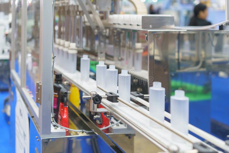 Automated Bottling System in Action Stock Image - Image of packaging ...