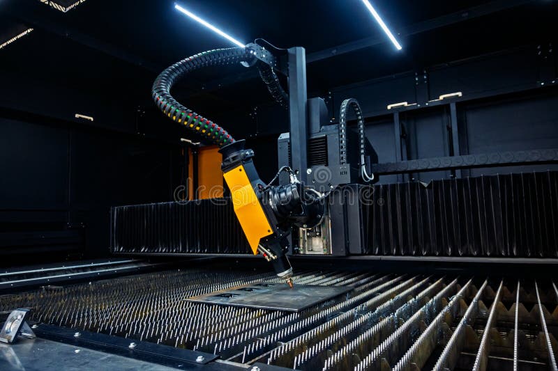 Automated Laser Cutting Machine Head Processing Metal Plate in a Dark ...