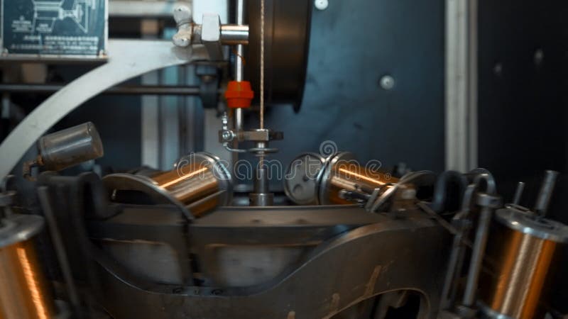 Automated Machine with Rotating Coils and Wire. Creative. Coils Rotate ...