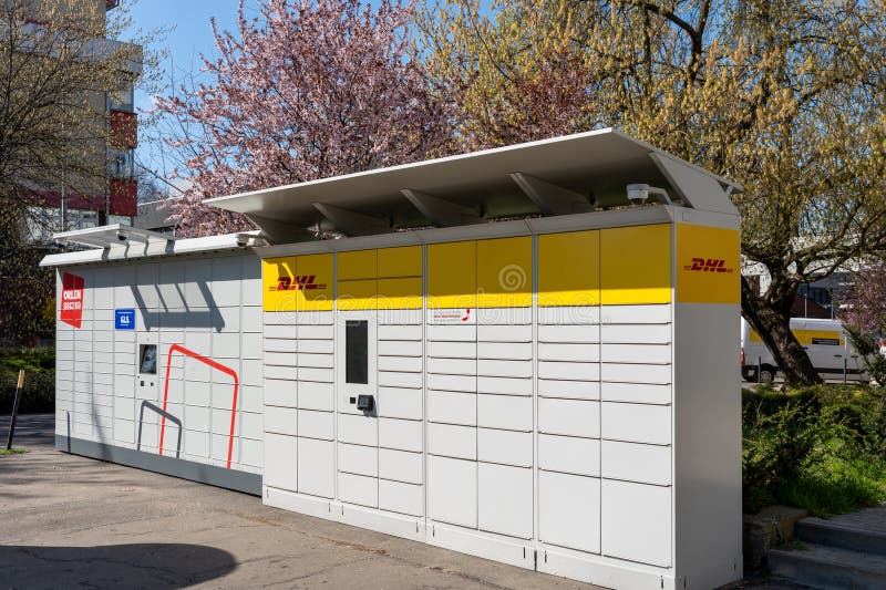 DHL Parcel Locker in Poland with Cherry Blossom Trees and Parked Vans ...