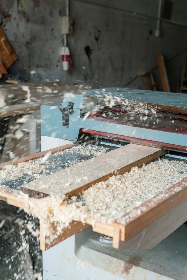 Automated Sanding Machine for Wood Boards. Wood Dusts Scattered ...