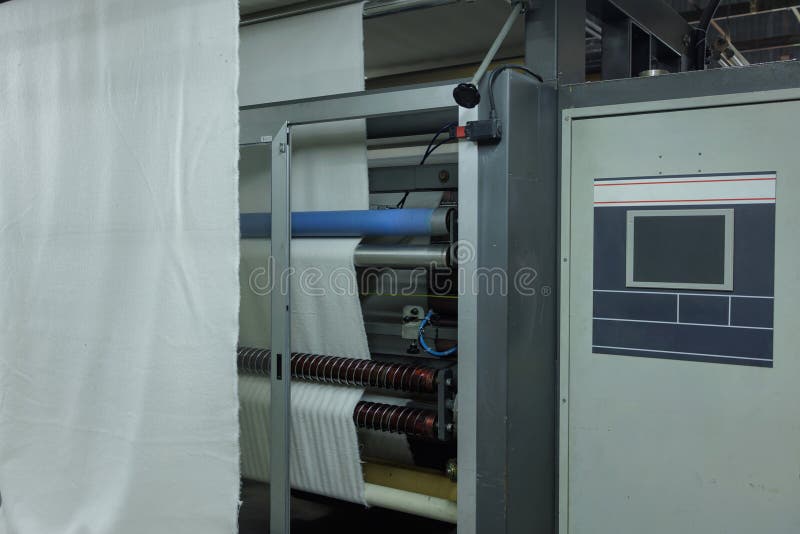 Automated Textile Manufacturing Machine Processing Fabric in Modern ...