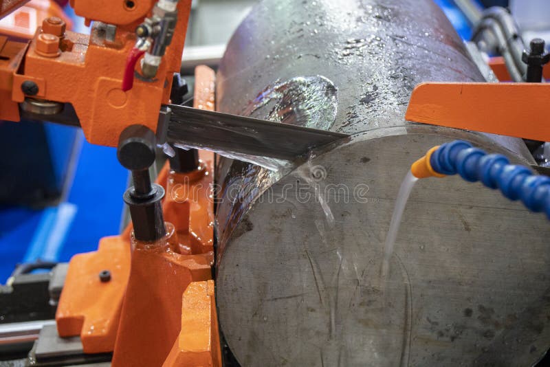 The Automatic Band Saw Machine Cutting the Metal Bar with Coolant ...