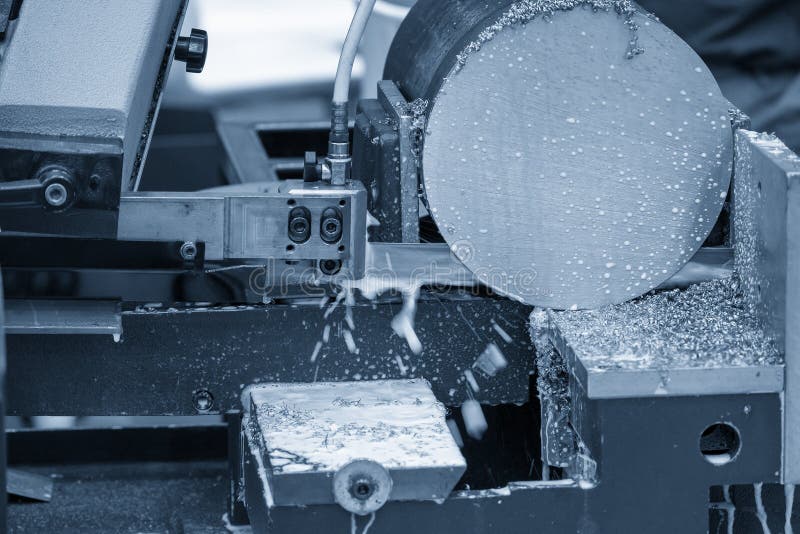 The Automatic Band Saw Machine Cutting the Metal Rod with Water Base ...