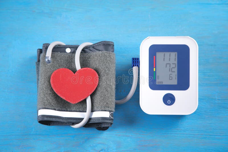 Automatic Blood Pressure Meter and Red Heart on the Blue Background ...