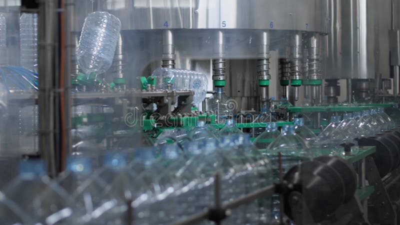 Automatic Bottle Rinsing, Filling and Capping Machine. Automation of ...