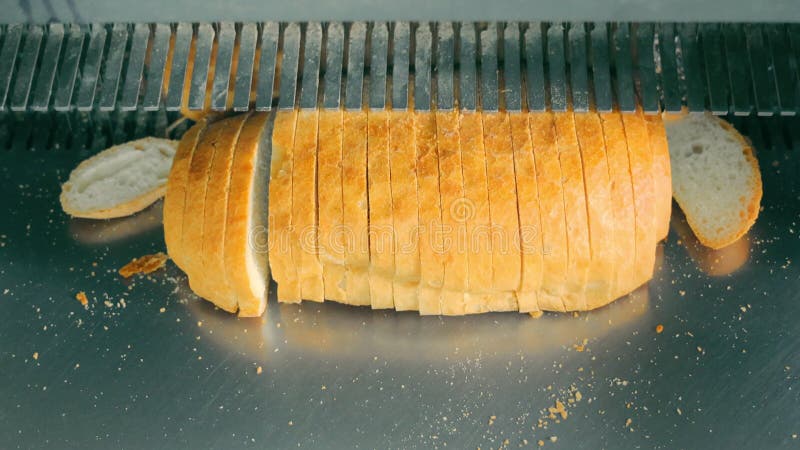 Automatic Bread Slicer. Slicing Bread at the Bakery Stock Video - Video ...