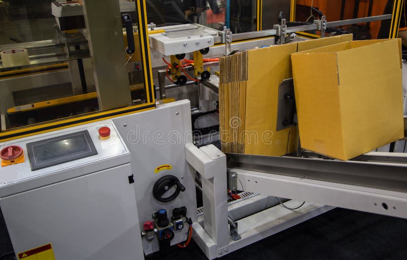 Automatic carton erector stock photo. Image of former - 104894762