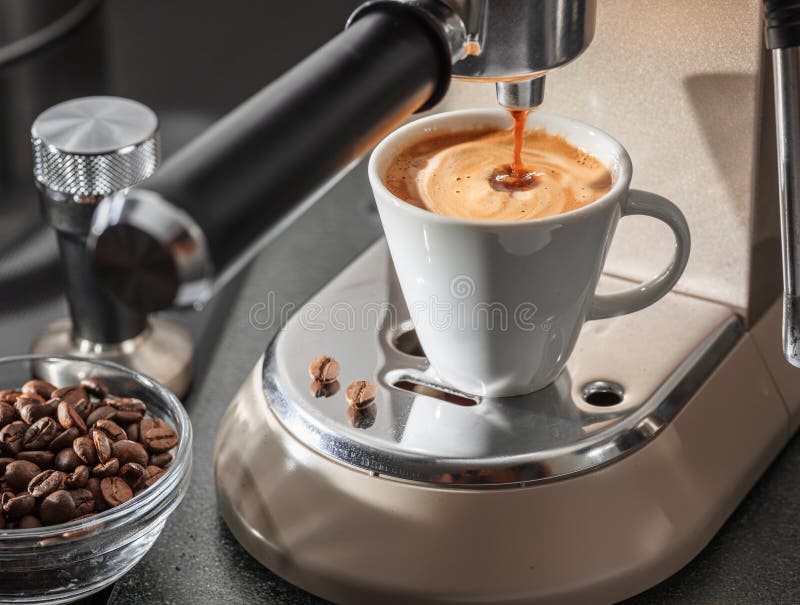Automatic Coffee Machine. Pouring Coffee into the Coffee Cup Closeup ...