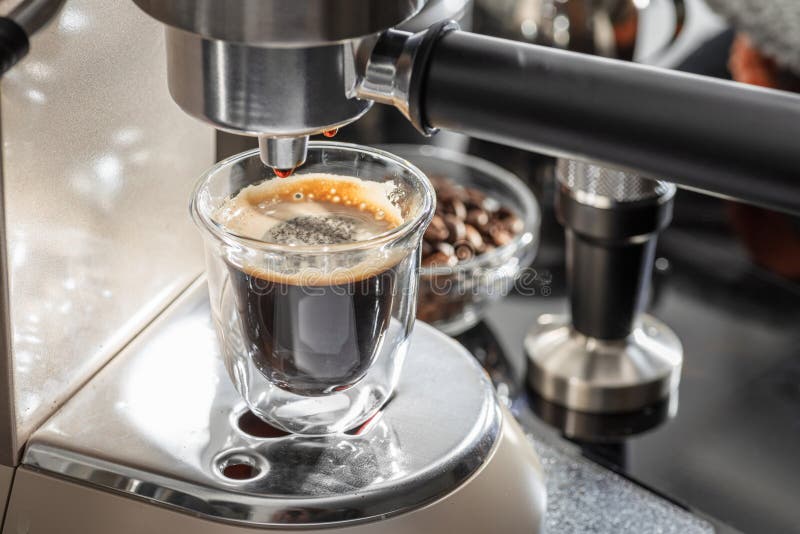 Automatic Coffee Machine. Pouring Coffee into the Coffee Cup Closeup ...