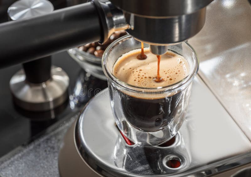 Automatic Coffee Machine. Pouring Coffee into the Coffee Cup Closeup ...
