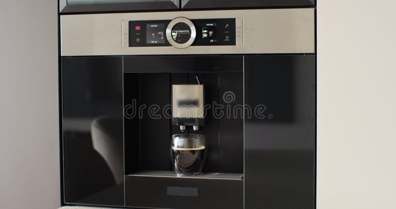 Automatic Coffee Machine Pours Coffee into Mug in Kitchen at Home. Hot ...