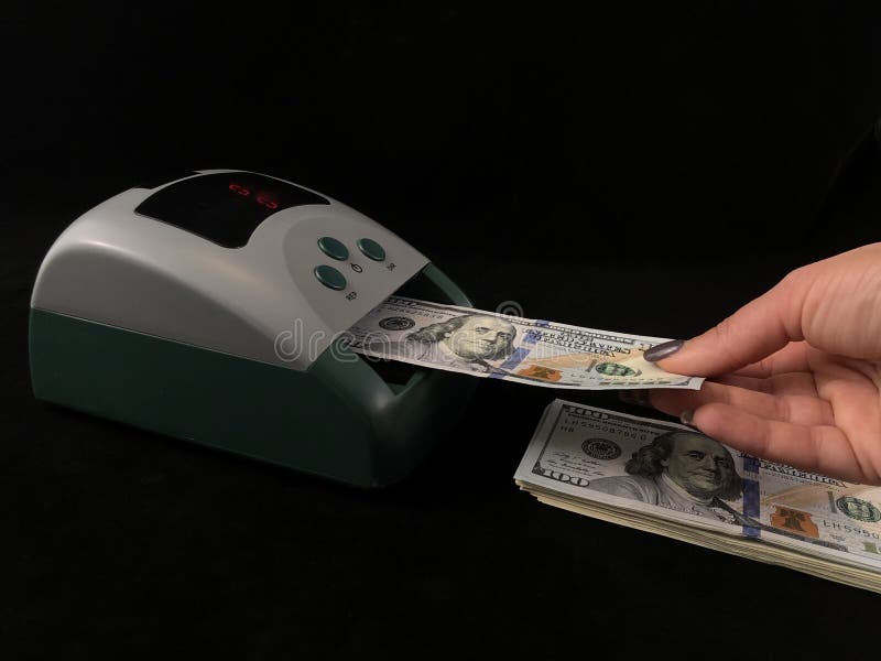 Automatic Detector for Checking Banknotes. Dollars are Checked through ...