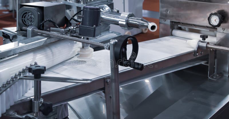 Automatic Dough Encrusting and Moulding Machine Stock Photo - Image of ...