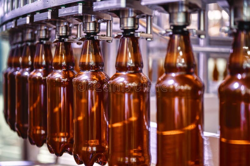 Automatic Filling Machine, the Process of Filling Plastic Bottles with ...