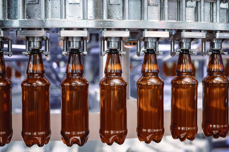 Automatic Filling Machine, the Process of Filling Plastic Bottles with ...