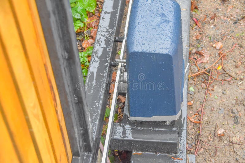 A Automatic Gate Mechanism on the Garden Plot Stock Photo - Image of ...