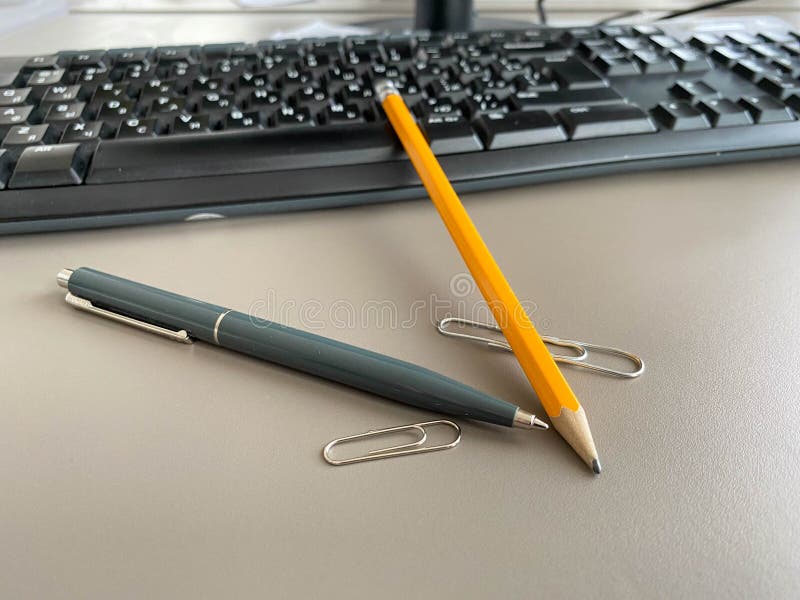 Automatic Green Ballpoint Pen and Writing Pencil on Desktop Office Desk ...