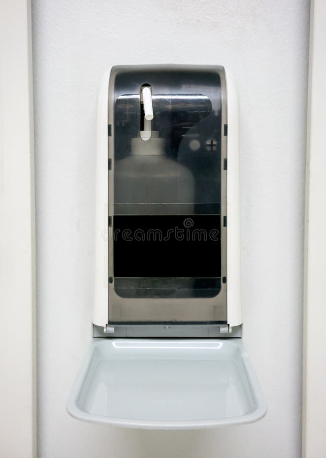 Automatic Hand Sanitizer Dispenser on White Wall Stock Image - Image of ...
