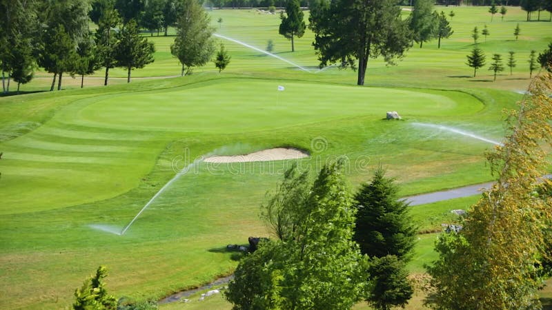Automatic High-pressure Water Sprinkler at Green Golf Course Watering ...