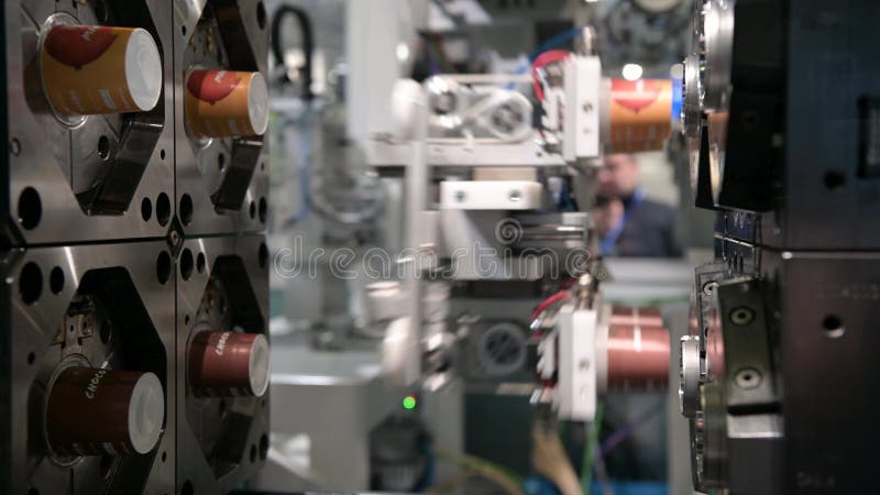 An Automatic Injection Press Stamps Plastic Cups. Stock Video - Video ...