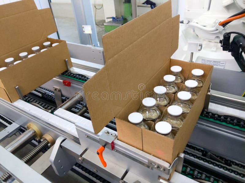 Automatic Line for Packaging Medicines in Cardboard Packaging. Stock ...