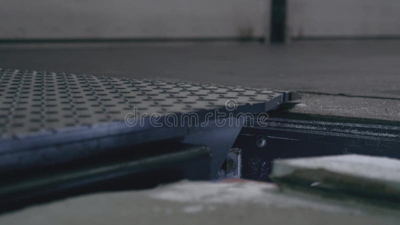 Close-up Automatic Loading Platform Lowered in the Logistics Center ...