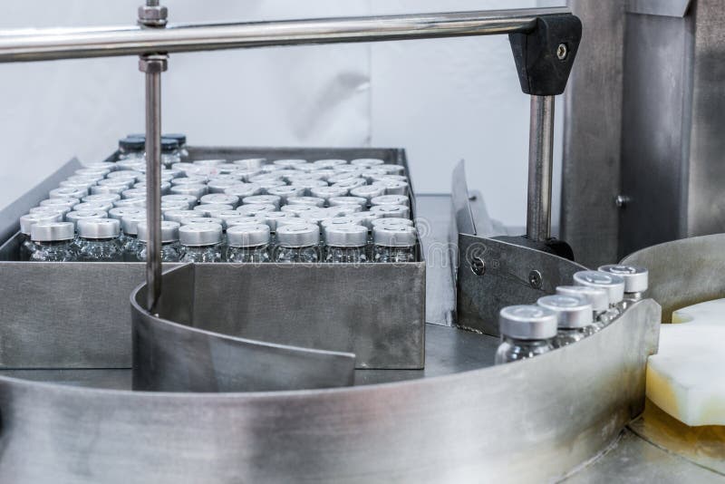 Automatic Machine for Capping Glass Bottles. Stock Photo - Image of ...