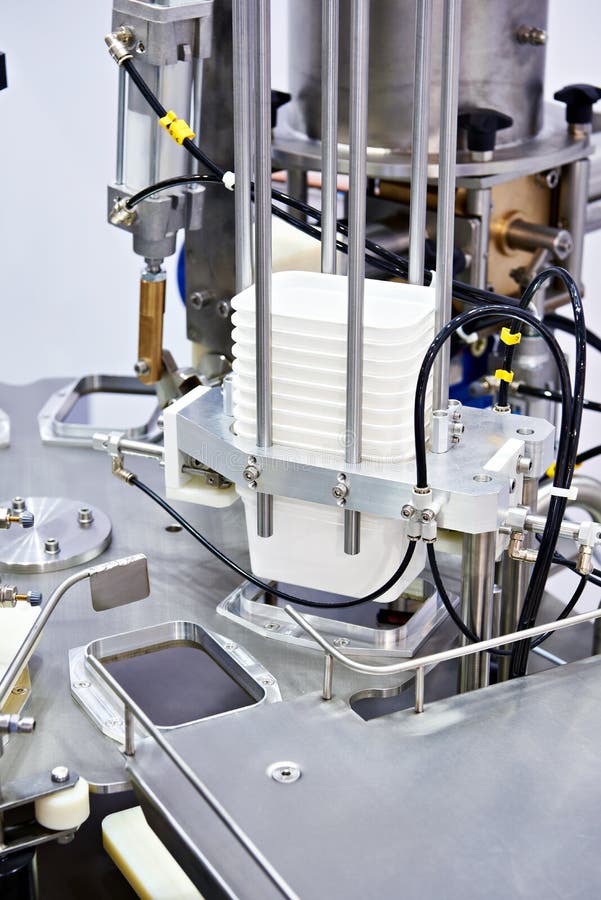 Machine for Packing Cheese in Plastic Containers Stock Image - Image of ...