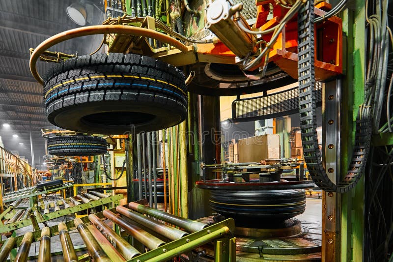 The Automatic Manipulator Holds the Finished Car Tire after the End of ...