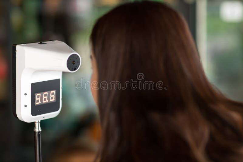 Automatic Measuring Temperature Woman at Hospital .Covid-19 Test ...