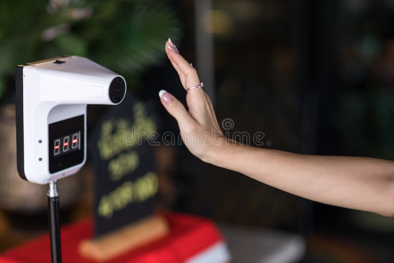 Automatic Measuring Temperature Woman at Hospital .Covid-19 Test ...