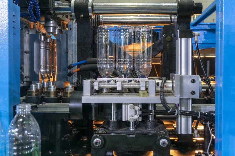 The Automatic Plastic Bottle Blowing Machine Making the PET Bottle ...