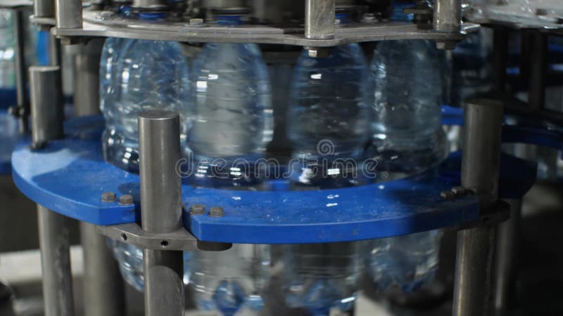 Automatic Bottle Rinsing, Filling and Capping Machine. Automation of ...