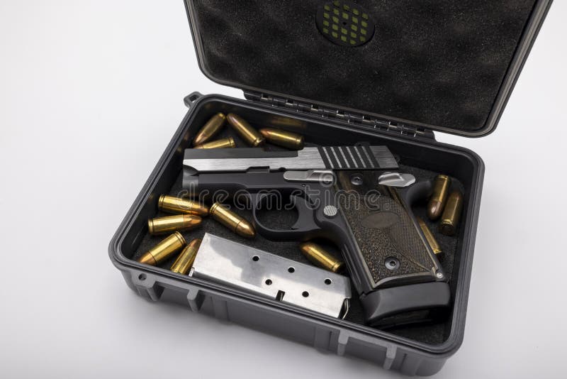 Automatic Pocket Handgun and Bullets in a Plastic Hard Case on White ...