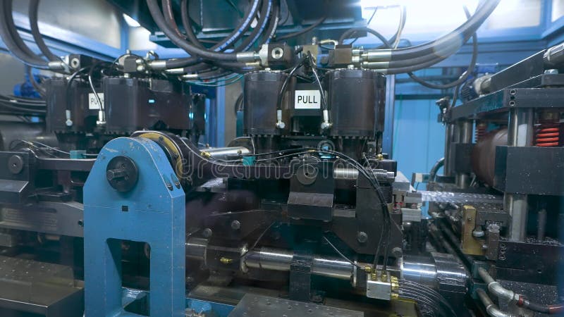 Automatic Punching Line. the Powerful Machine Punches Holes in the ...