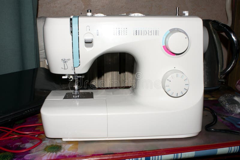 Automatic Sewing Machine.Sewing Machine Background.Photo of a Compact ...