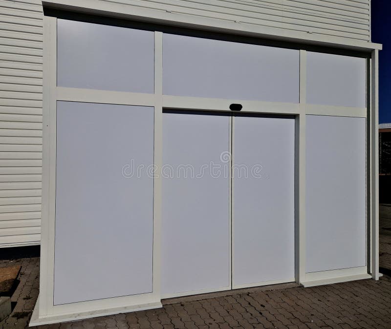 Automatic Sliding Door Operators and Door Systems Create a Stock Image ...