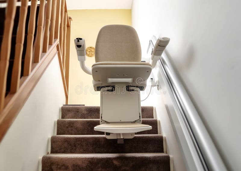 Automatic Stair Lift on Staircase Taking Elderly Stock Photo - Image of ...
