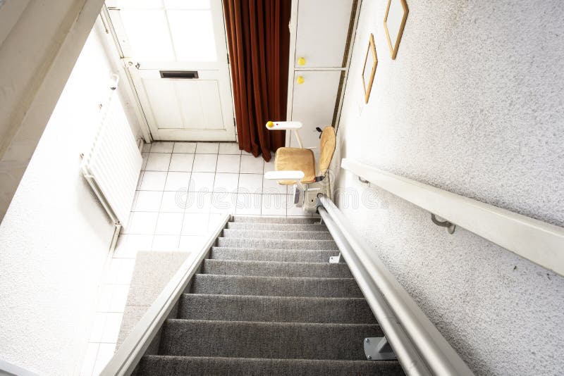 Automatic Stair Lift on Staircase Taking Elderly People and Disabled ...