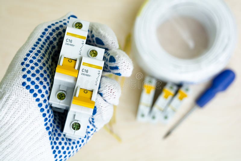 Automatic Switches in Hand on the Background of Power Tools. Set of ...