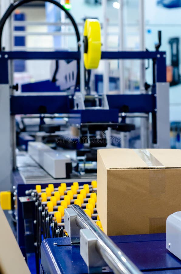 Automatic Tape Carton Sealing Machine,box Folding Machine Stock Photo ...