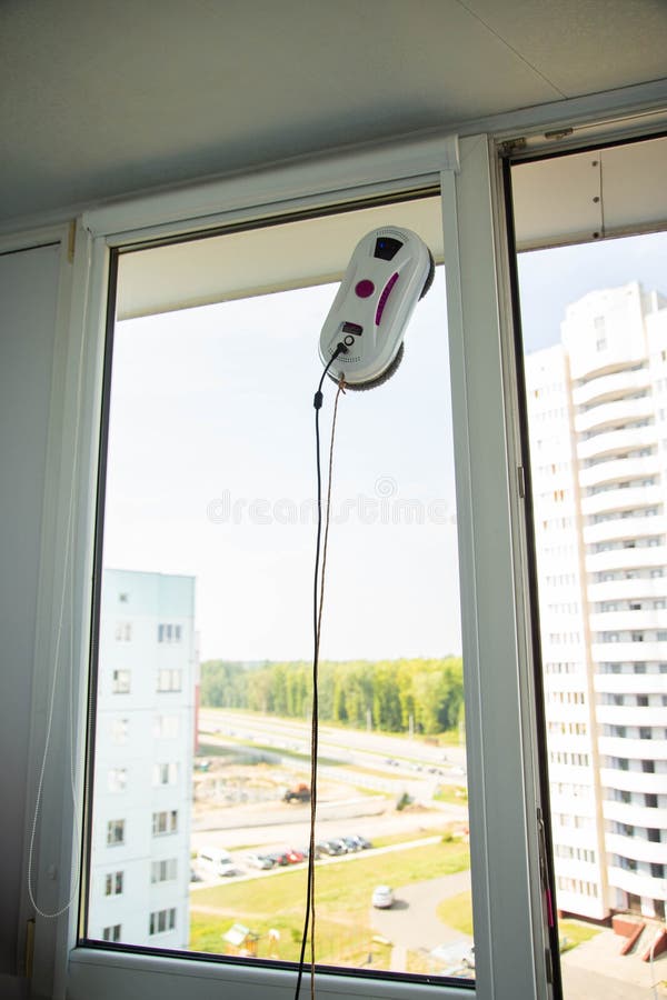 Automatic Vacuum Robot Window Cleaner Washes Glass in the Apartment ...