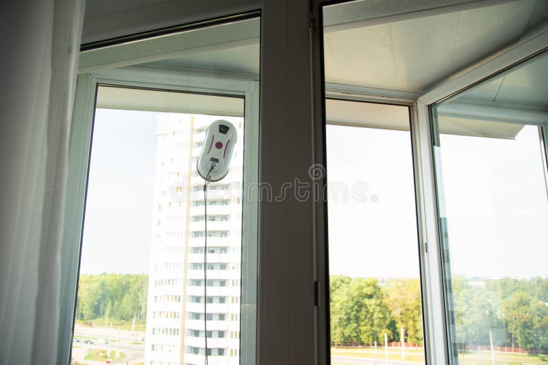 Automatic Vacuum Robot Window Cleaner Washes Glass in the Apartment ...