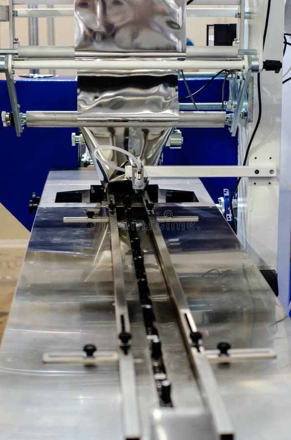 Automatic Vacuum Sealed Packaging Line Stock Photo - Image of filling, automatic: 220700312