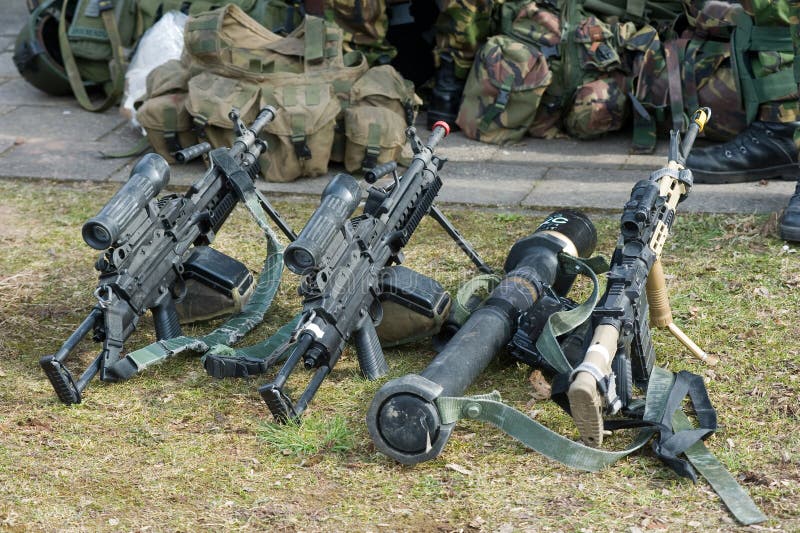 Automatic Weapons on Ground Stock Photo - Image of shooter, uniform ...