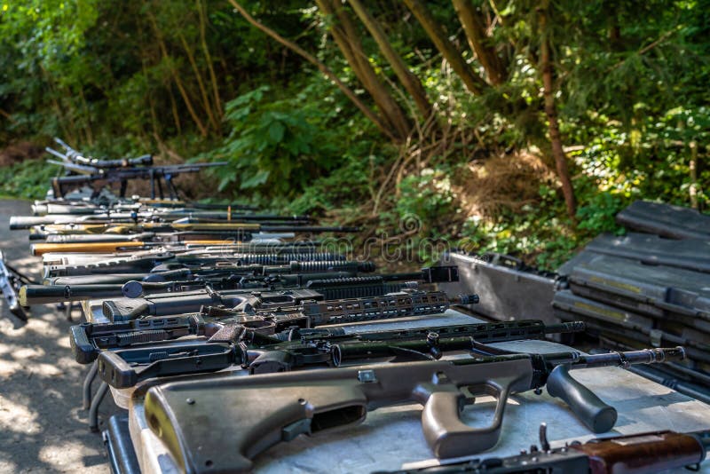 Automatic Weapons on Ground Stock Photo - Image of shooter, uniform ...