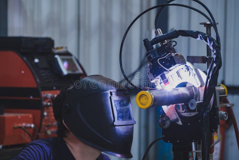 Automatic Welding Machine. the Welder Monitors the Quality of the ...